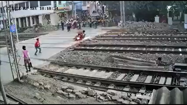 Rajdhani Express crashes two wheeler into pieces: See how biker nearly ...