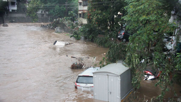 Pune hit hard as rains play havoc; Watch flooded rly station, submerged ...