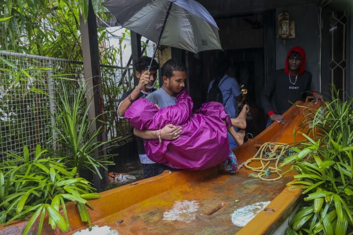 In Pics: Cyclone Michaung Disrupts Normal Life in Chennai - Oneindia